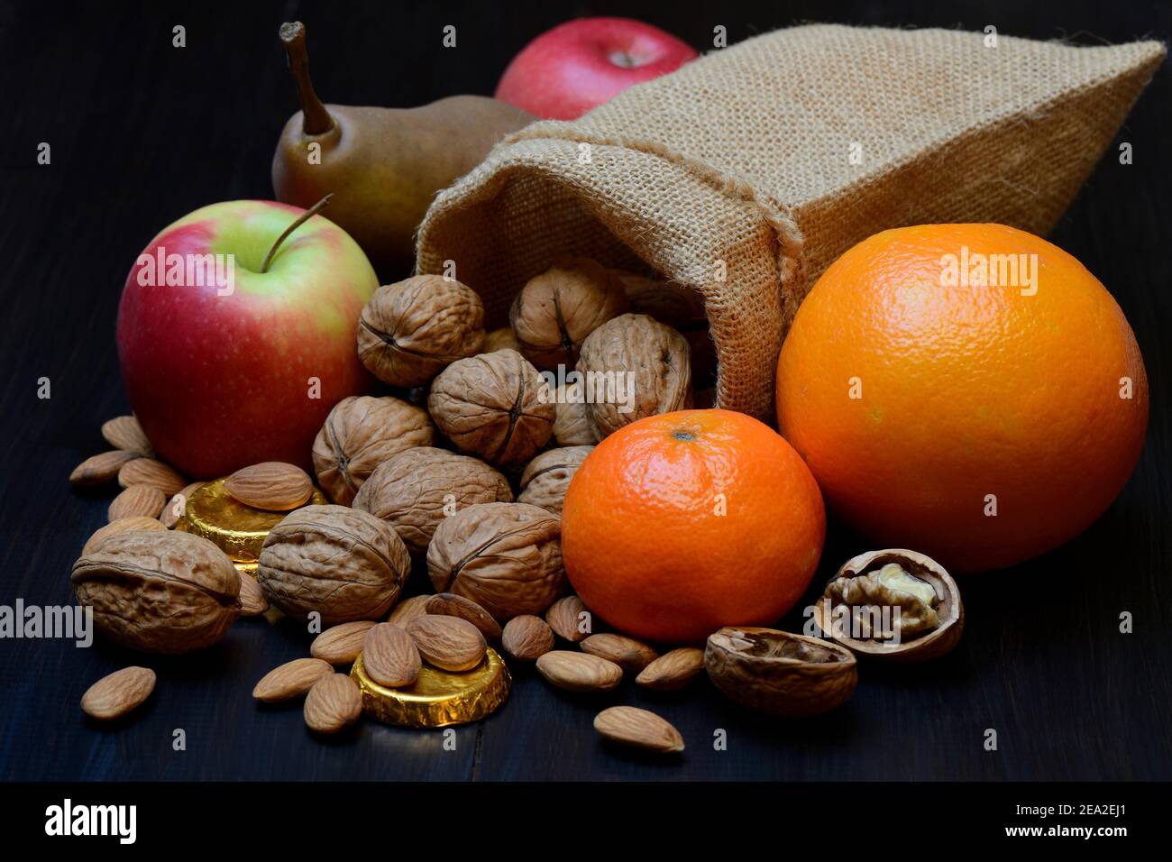Nuts and fruits for St. Nicholas Day, almonds, apples, pears, orange ...