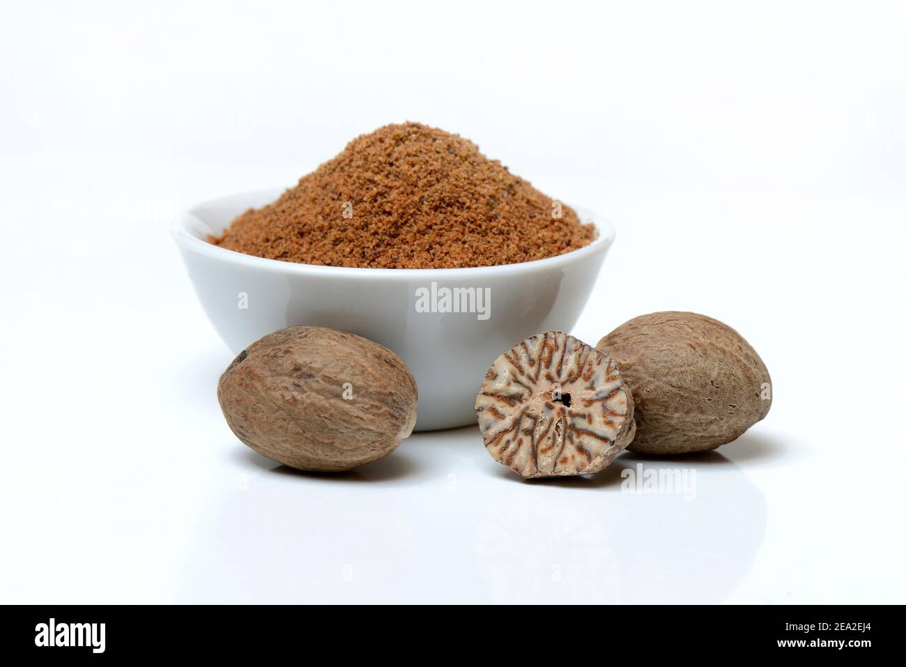 Nutmegs and nutmeg powder in shell, ground ( Myristica fragrans Stock ...
