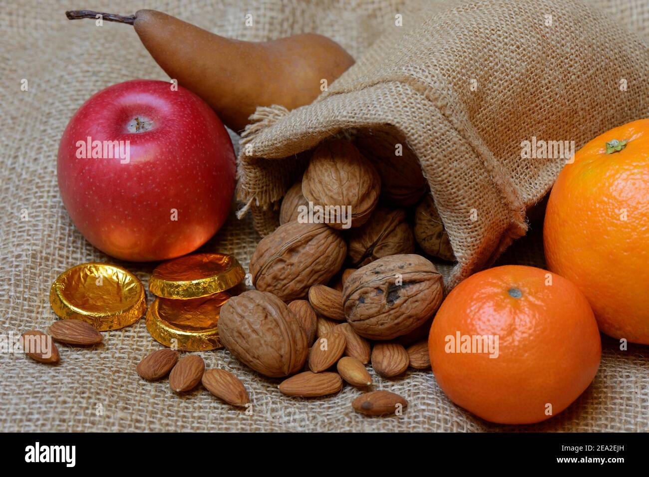 Nuts and fruits for St. Nicholas Day, almonds, apples, pears, orange ...