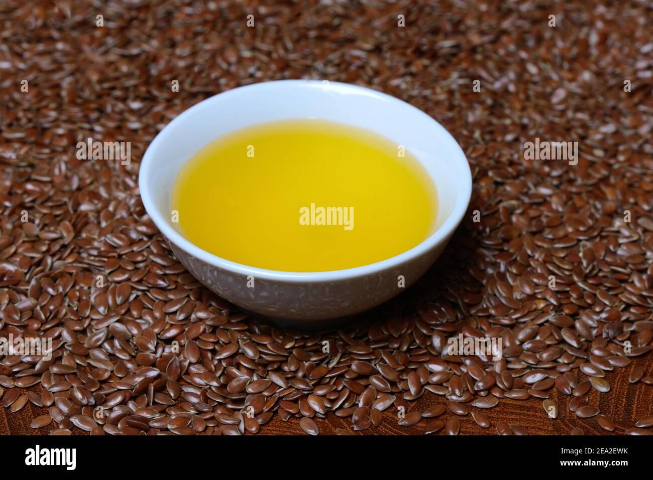 Linseed ( Linum usitatissimum) and linseed oil in shell Stock Photo - Alamy