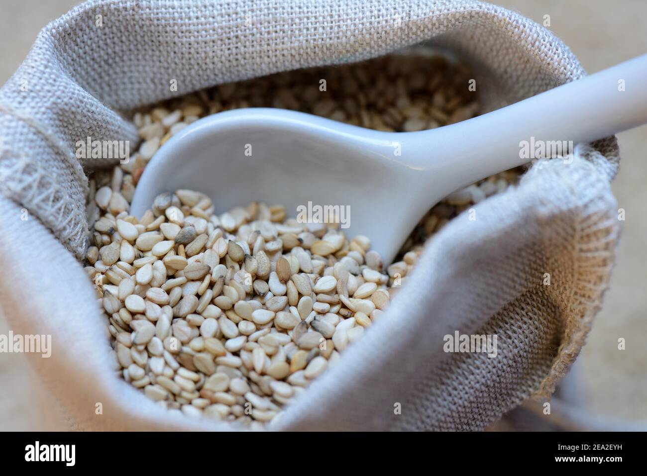 White seed ( Sesamum indicum) in bag with porcelain spoon Stock Photo ...