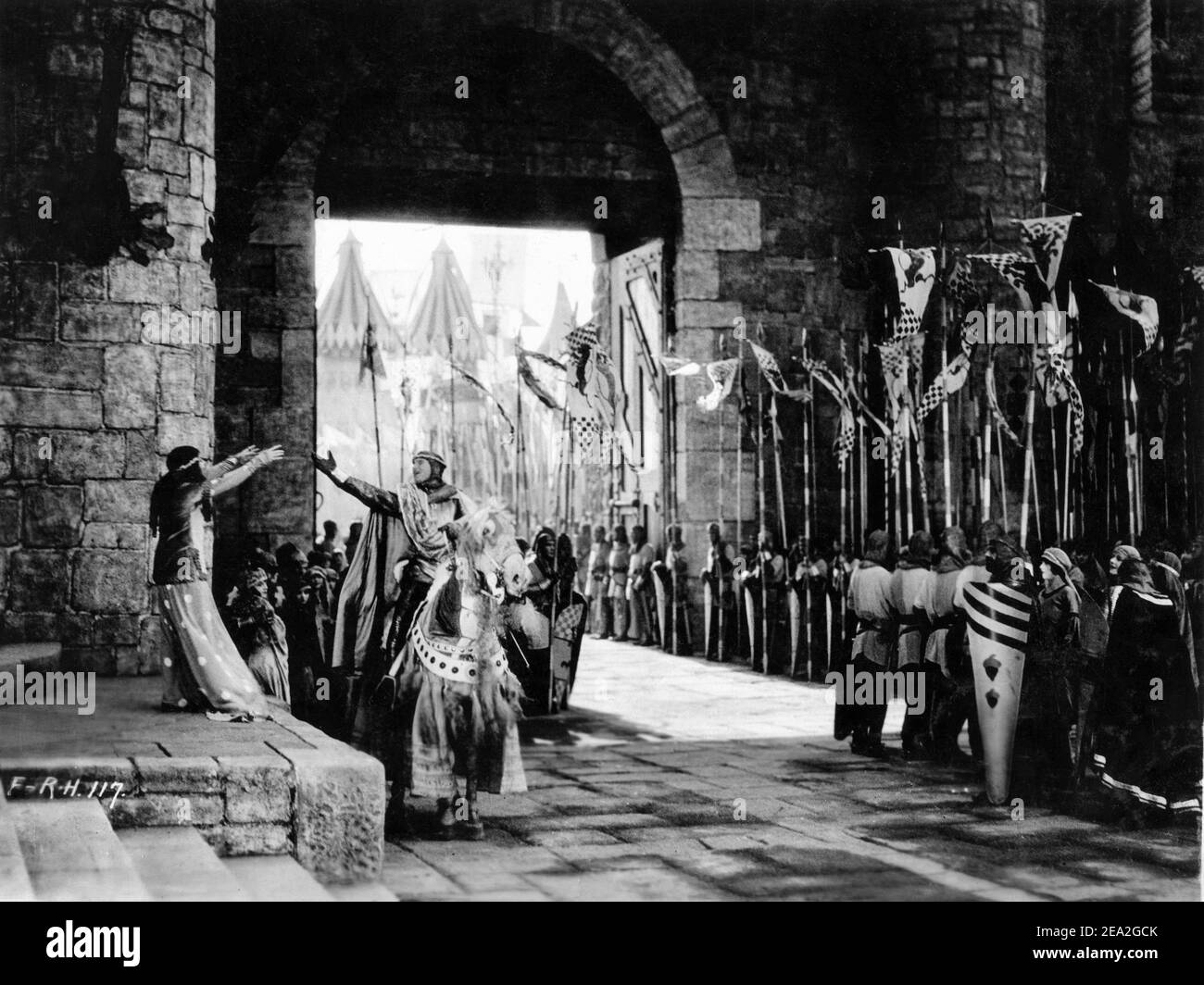 DOUGLAS FAIRBANKS Sr as The Earl of Huntingdon waves farewell to ENID ...