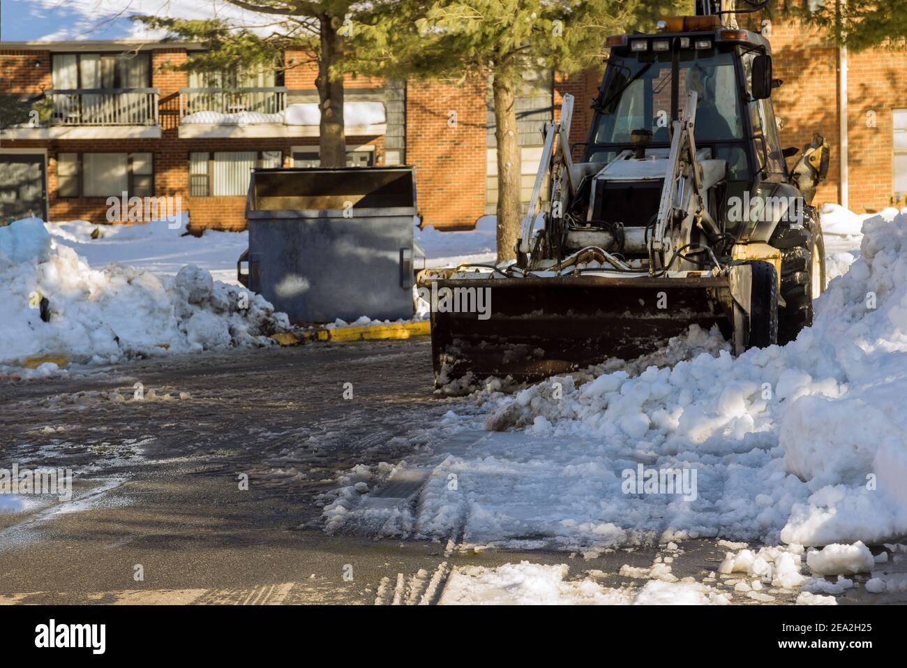 Municipal equipment removing snow outdoors cleaning street from the ...