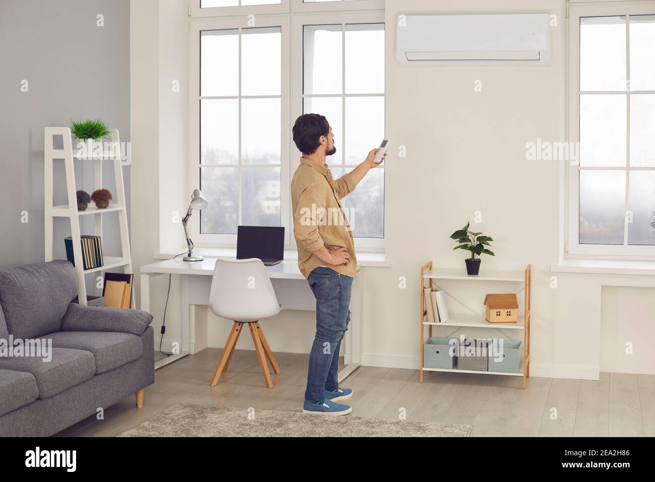 Person using remote control hi-res stock photography and images - Alamy