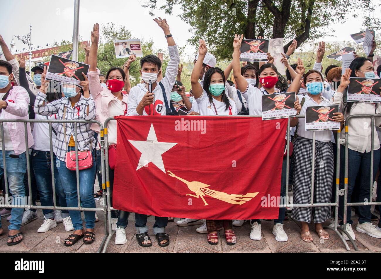A National League for Democracy (NLD) flag hanging on a metal fence ...