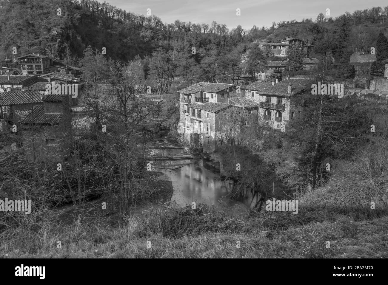 View of the river with old cereal mills in ancient medieval village of ...