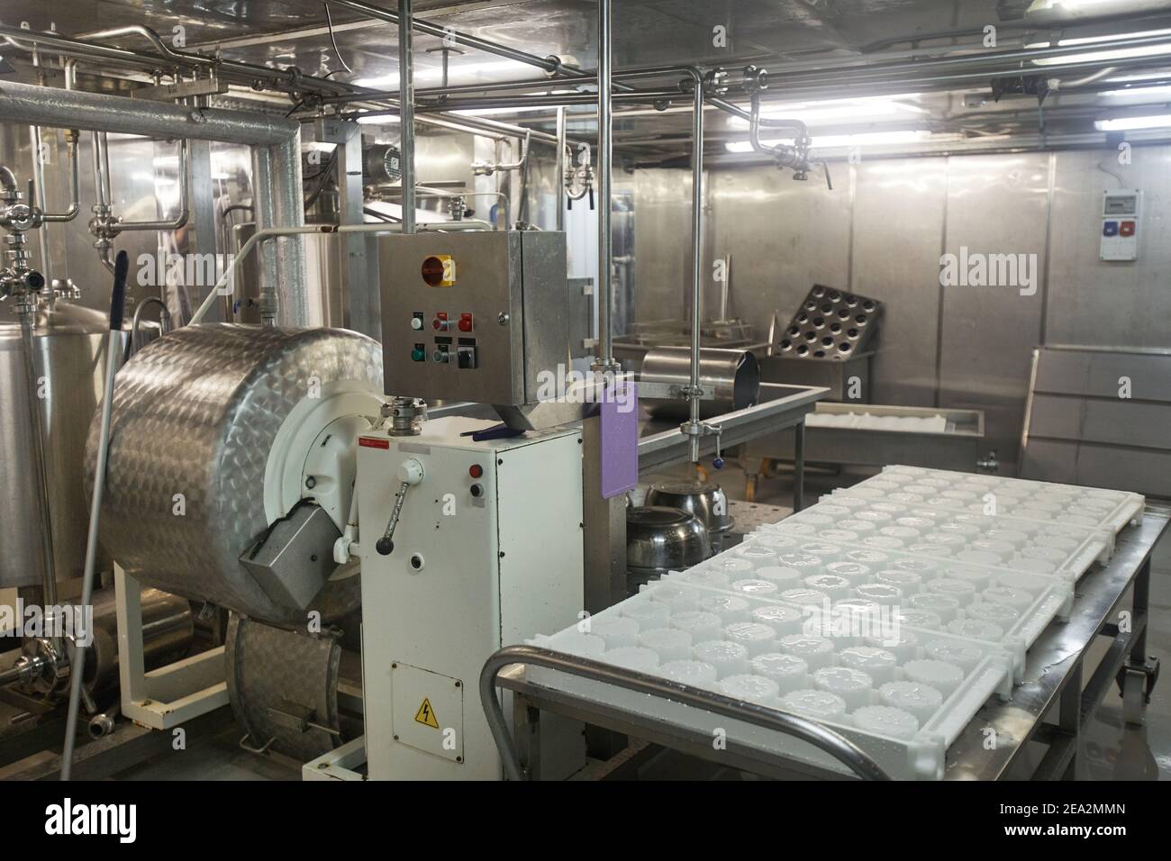 Background image or steel machinery equipment at cheese and dairy ...