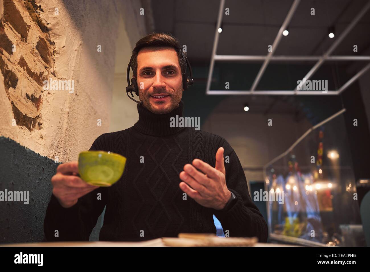 Man in headphones making call hi-res stock photography and images - Alamy