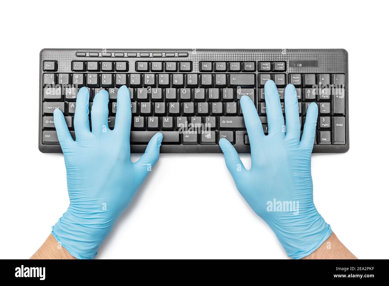 person works in protective medical gloves and types text on the ...