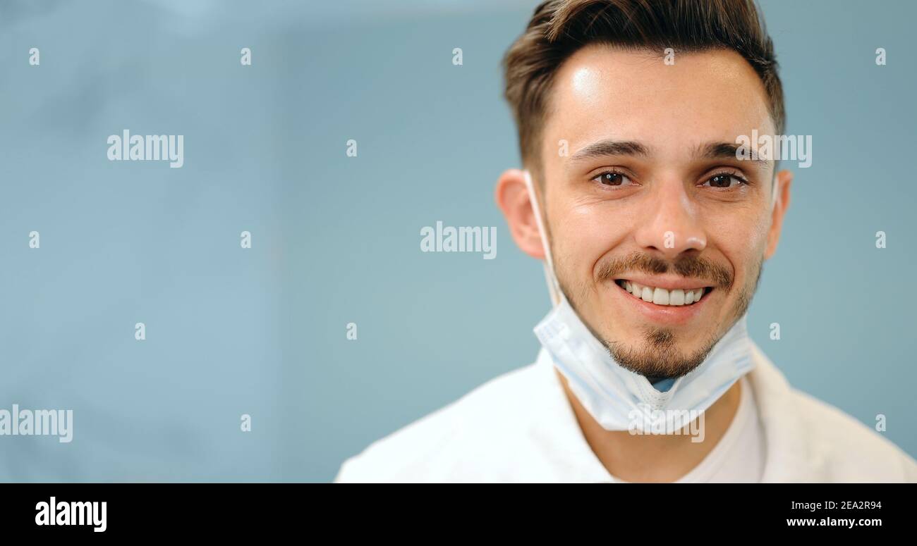 Portrait of a young smiling dentist at the dental office Stock Photo ...