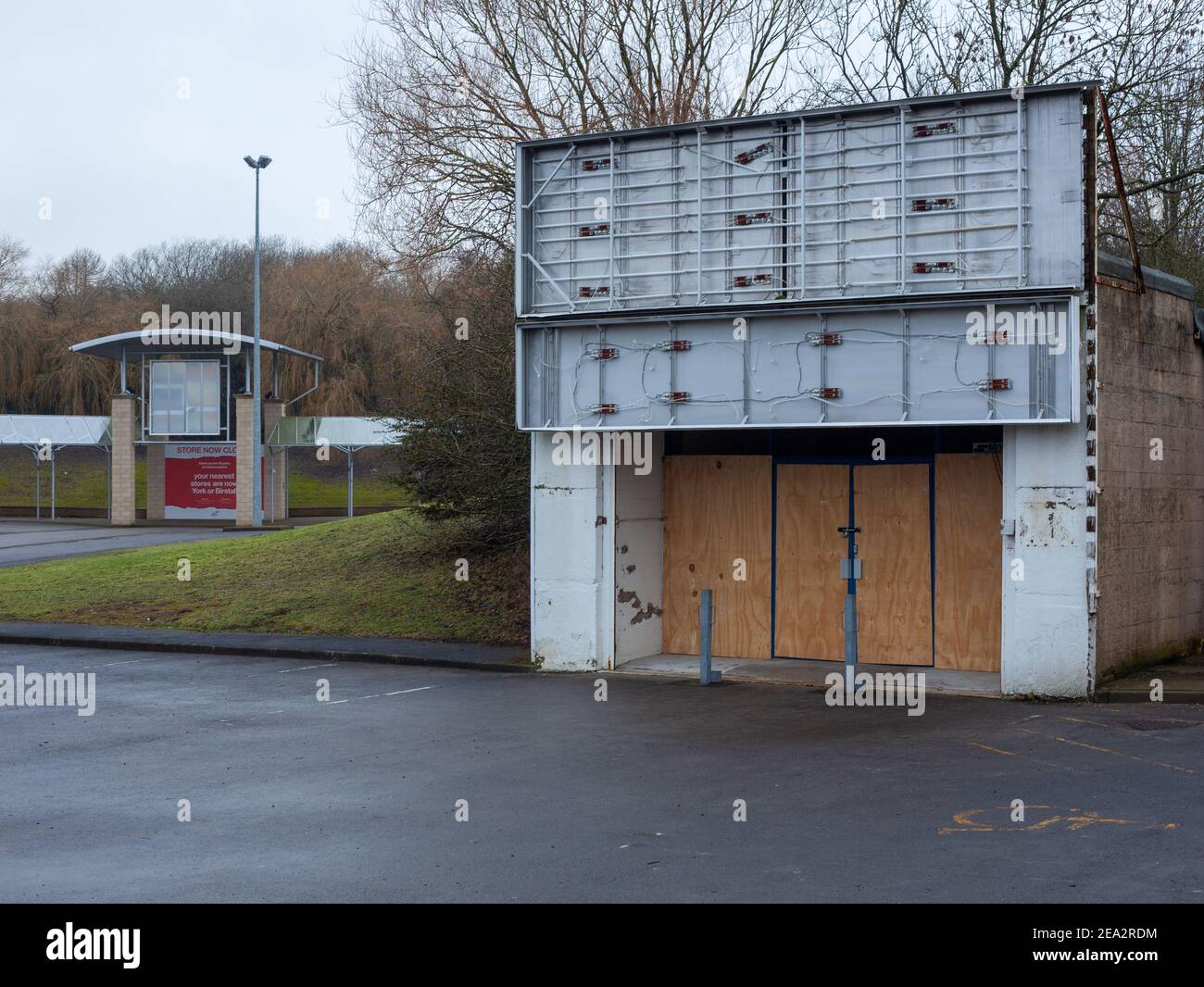 Closed and boarded up retail unit at the Buywell Shopping Centre in ...