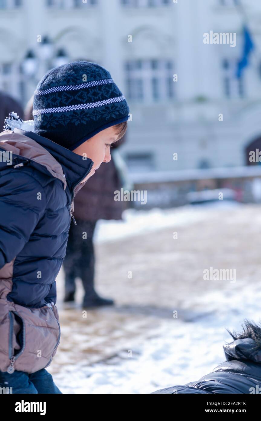 Timisoara, Romania - January 30, 2014: Kids playing with snow in the ...