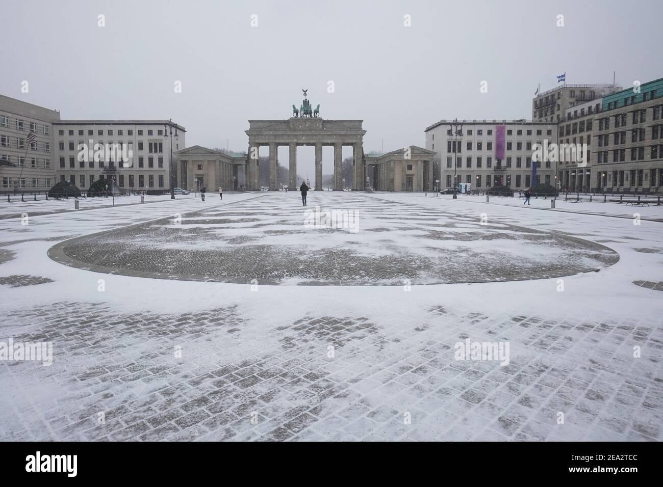 Berlin, Germany. 07th Feb, 2021. Snow lies on Pariser Platz in front of ...