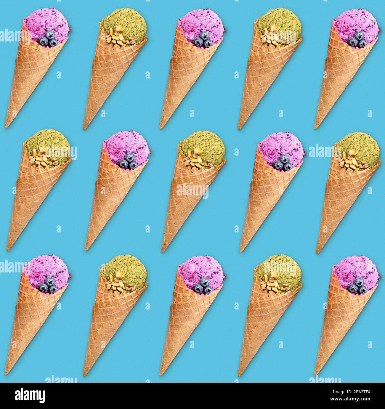 Symmetrical arrangement of ice cream cones on turquoise background ...