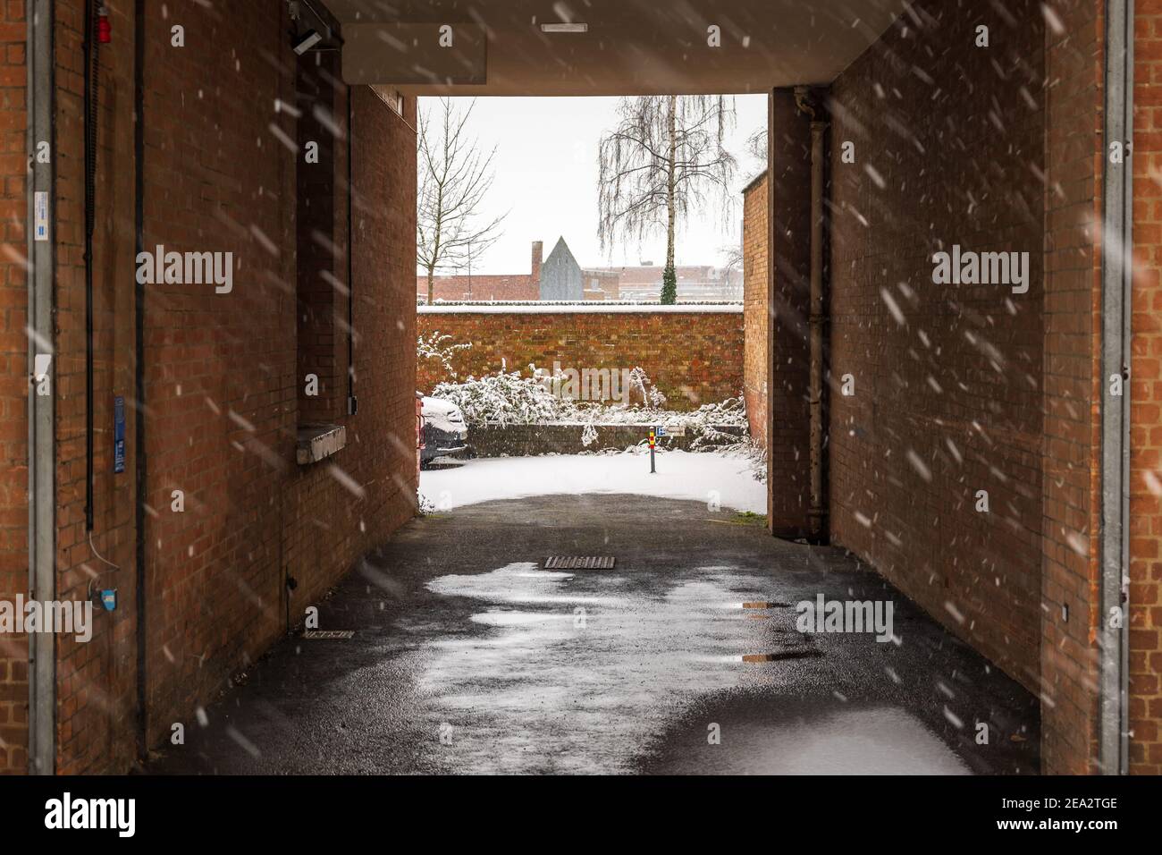 Architecture detail of backyard entrance under winter snow in england ...