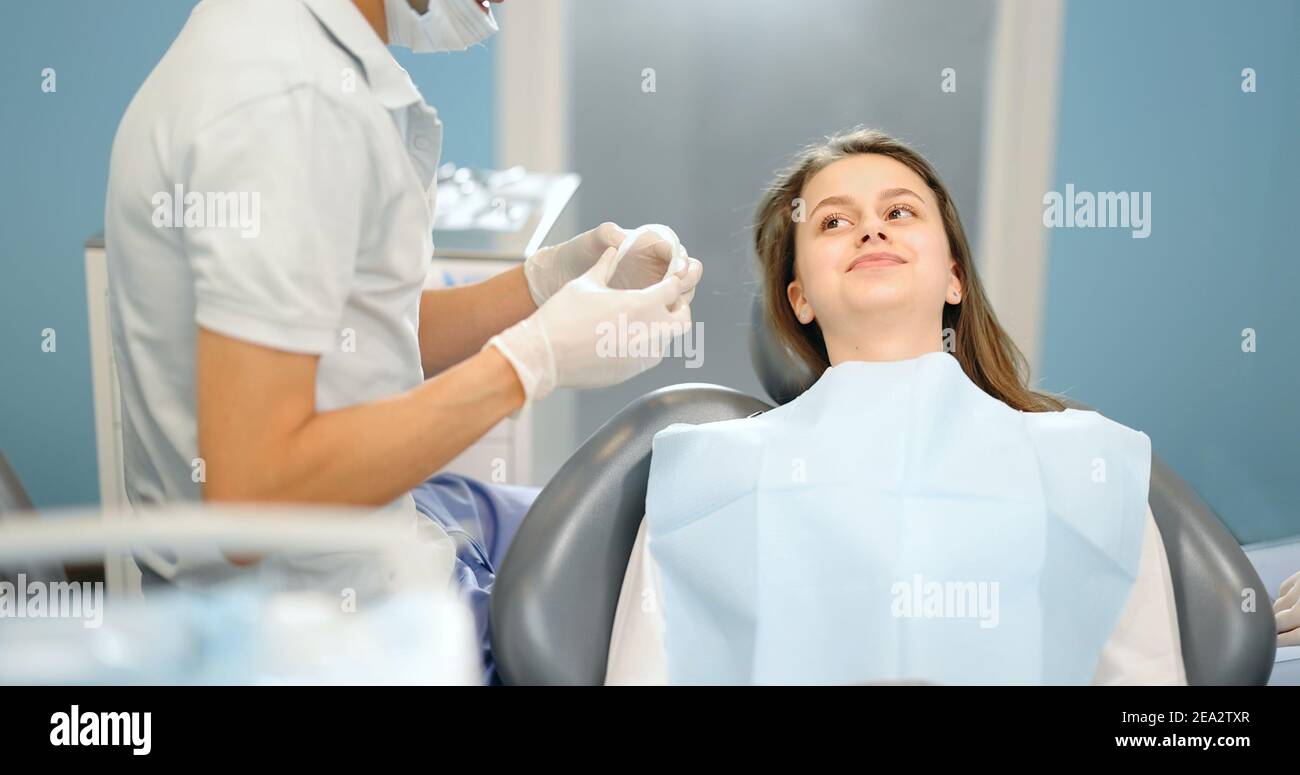 Dentist wearing optragate for the young patient Stock Photo - Alamy
