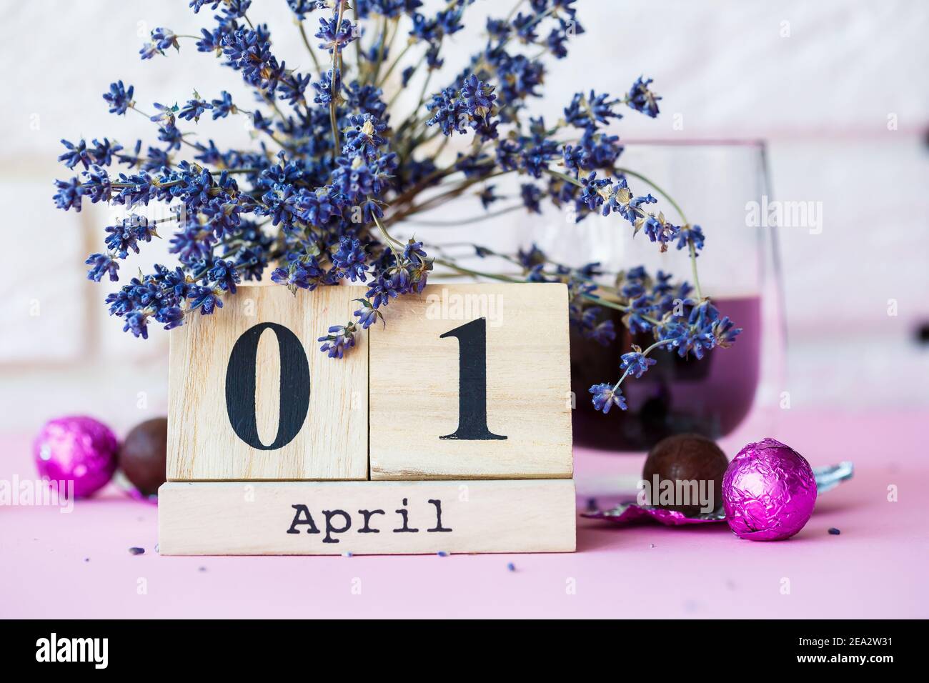 Hi spring. Wooden calendar with date 1 April, on pink background. World ...