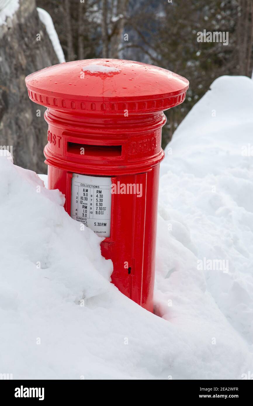 Famous red post box in the snowy alps Stock Photo - Alamy