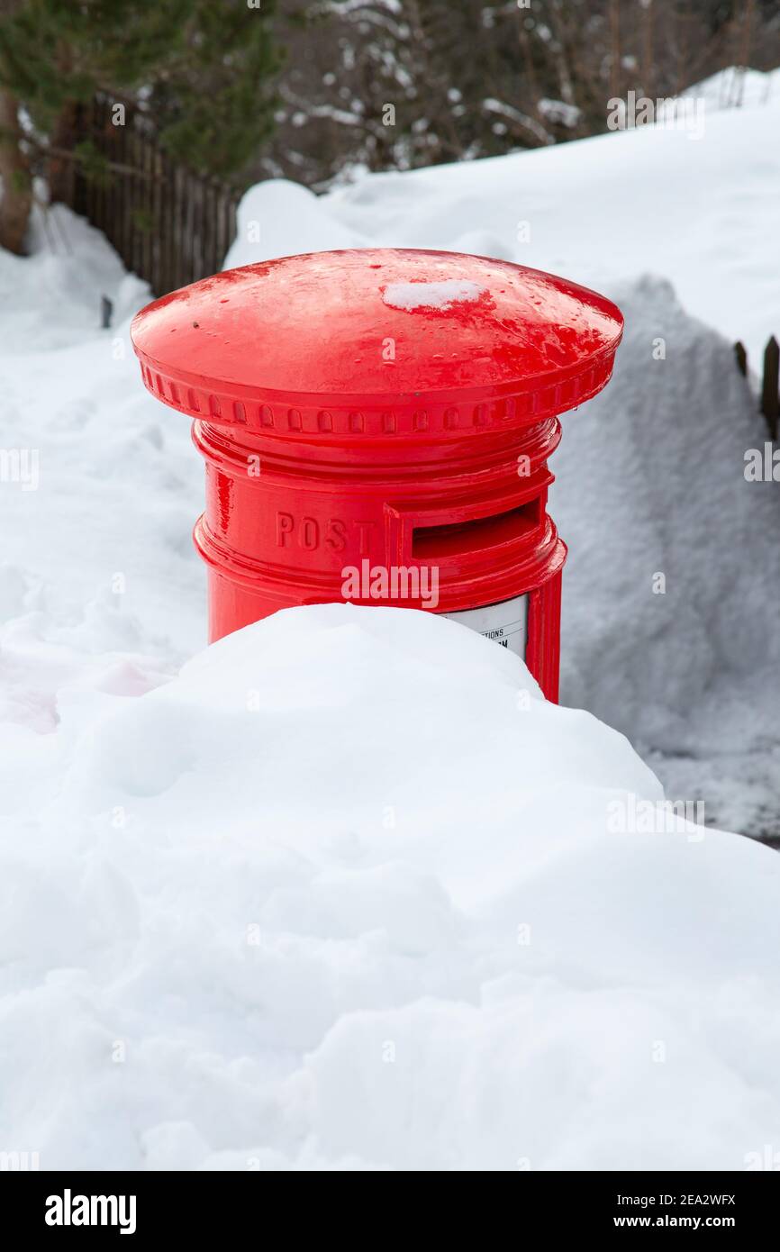 Famous red post box in the snowy alps Stock Photo - Alamy