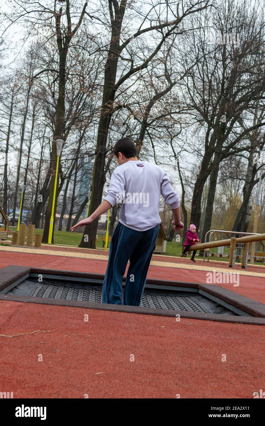 Timisoara, Romania - February 16, 2013: Kids jumping on a trampoline in ...
