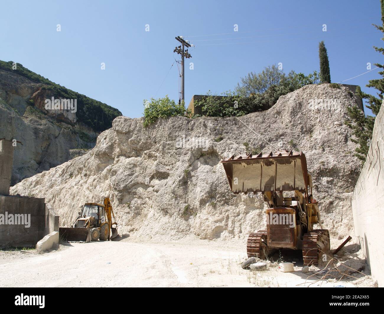 JCB digger and bulldozer at quarry at Troumpeta, Corfu, Greece Stock ...