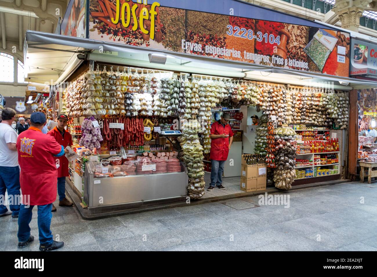 Rows of small packets of spices on sale at a large spice store at the ...