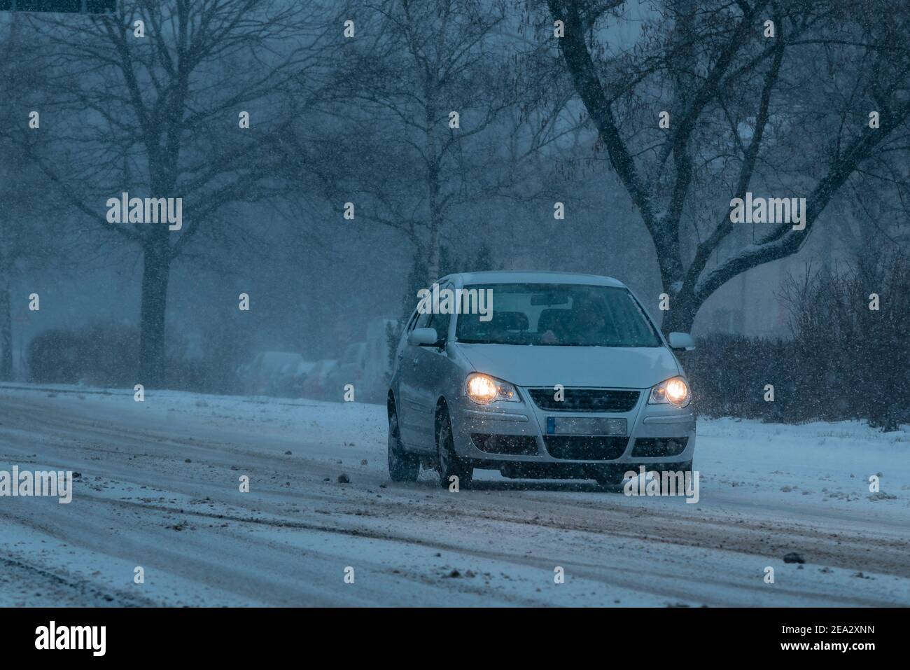 Cars driving in the snowstorm, cars driving in the snow, cars on a snow ...