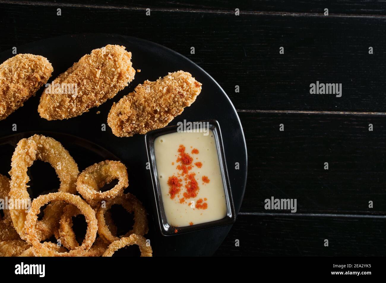 Beer snacks. Breaded meat appetizer and onion rings Stock Photo - Alamy