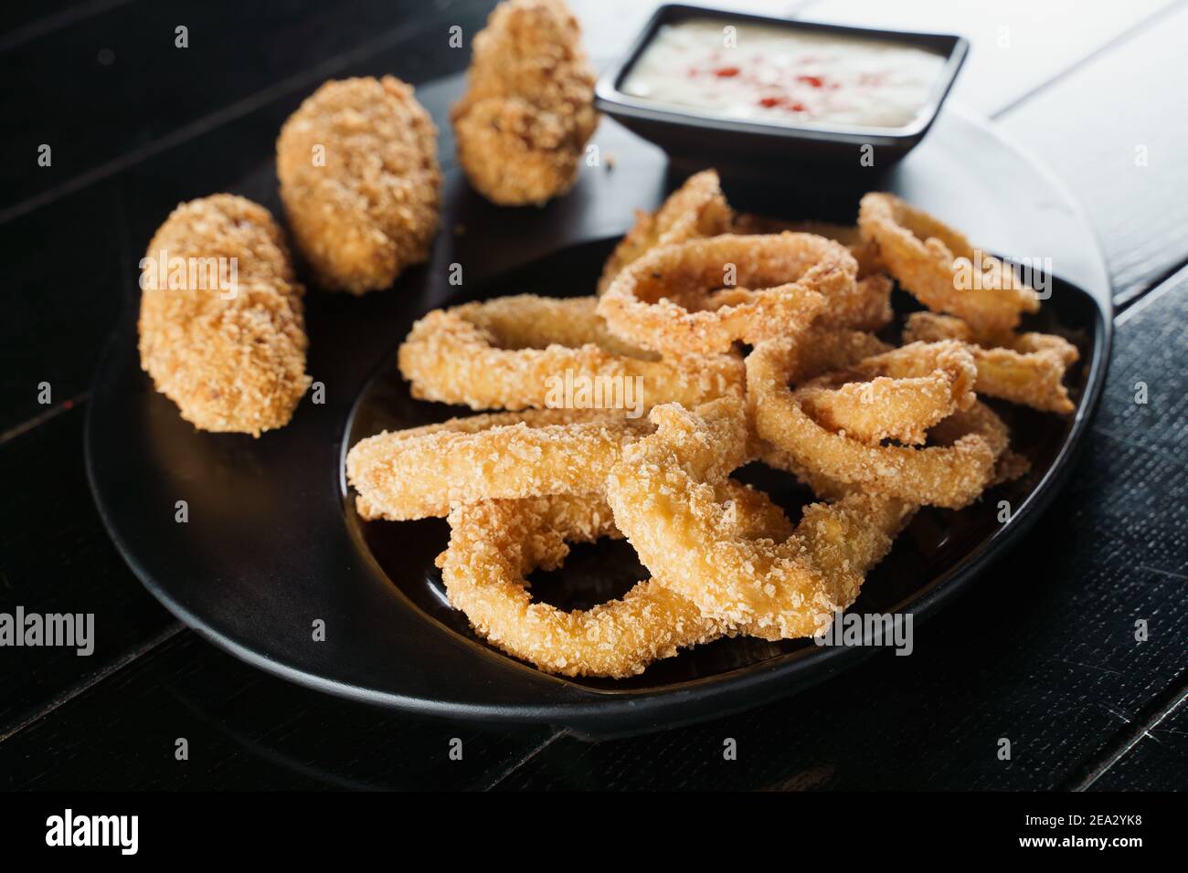 Beer snacks. Breaded meat appetizer and onion rings Stock Photo - Alamy