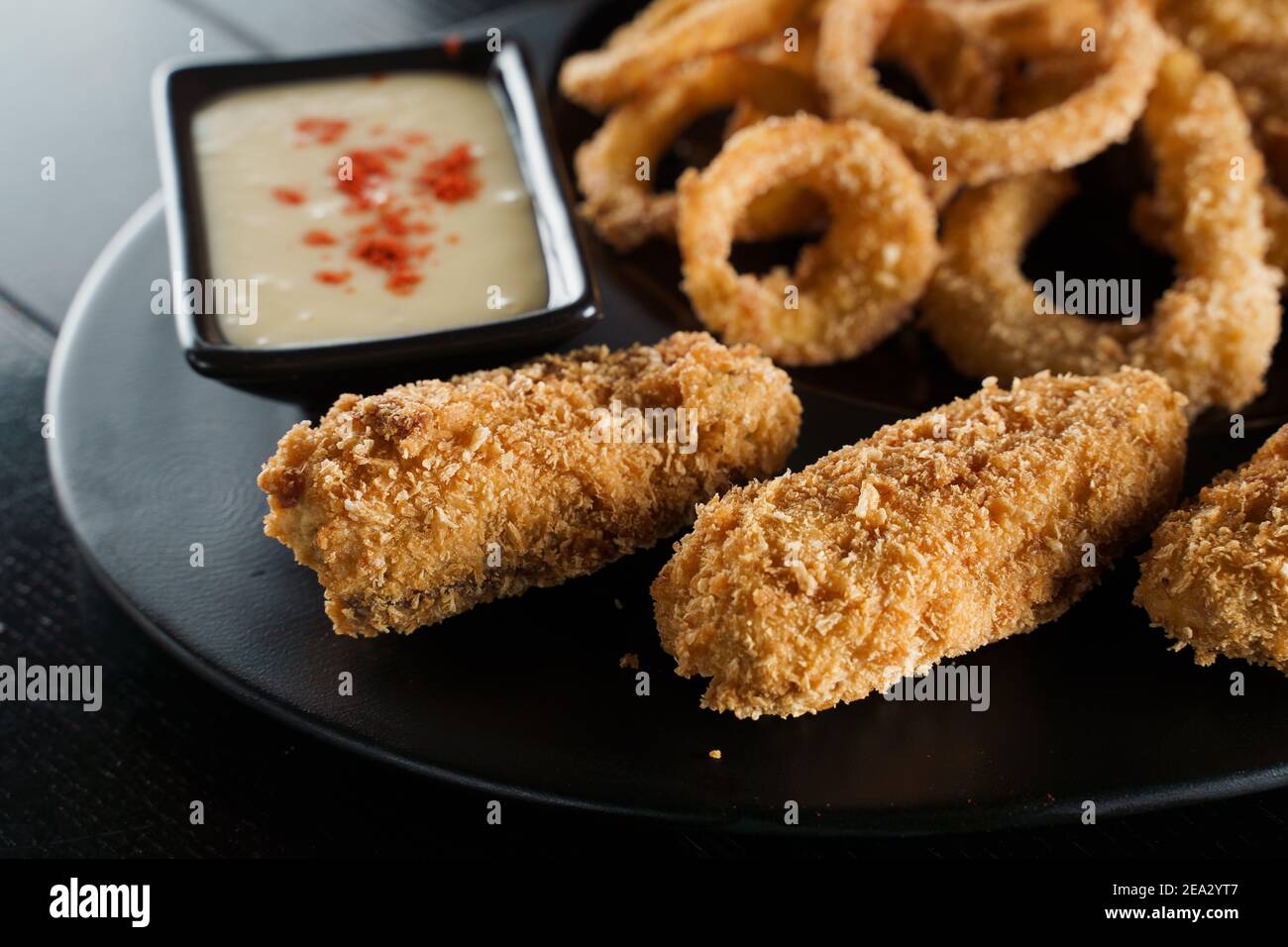 Beer snacks. Breaded meat appetizer and onion rings Stock Photo - Alamy