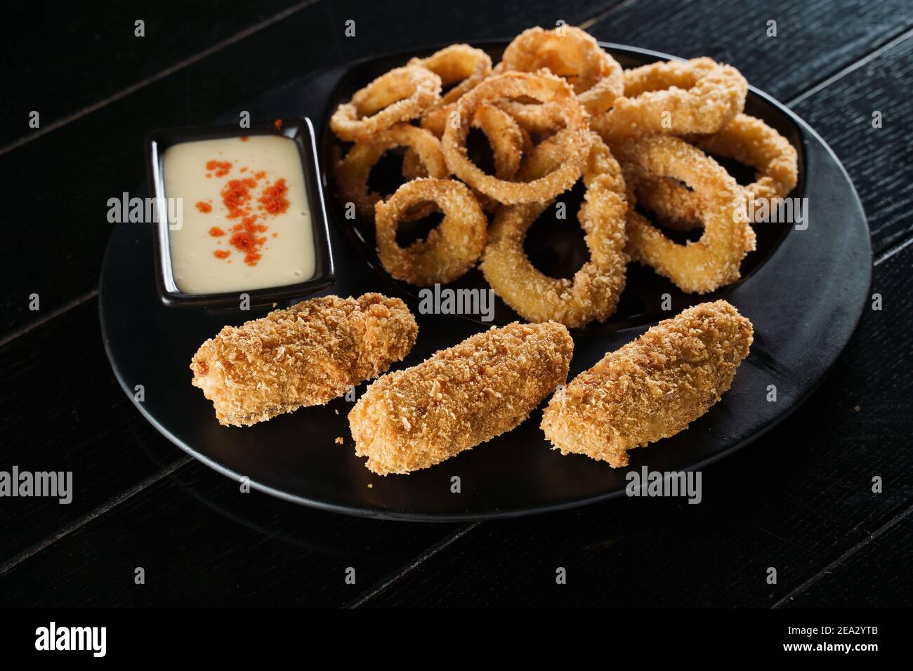 Beer snacks. Breaded meat appetizer and onion rings Stock Photo - Alamy