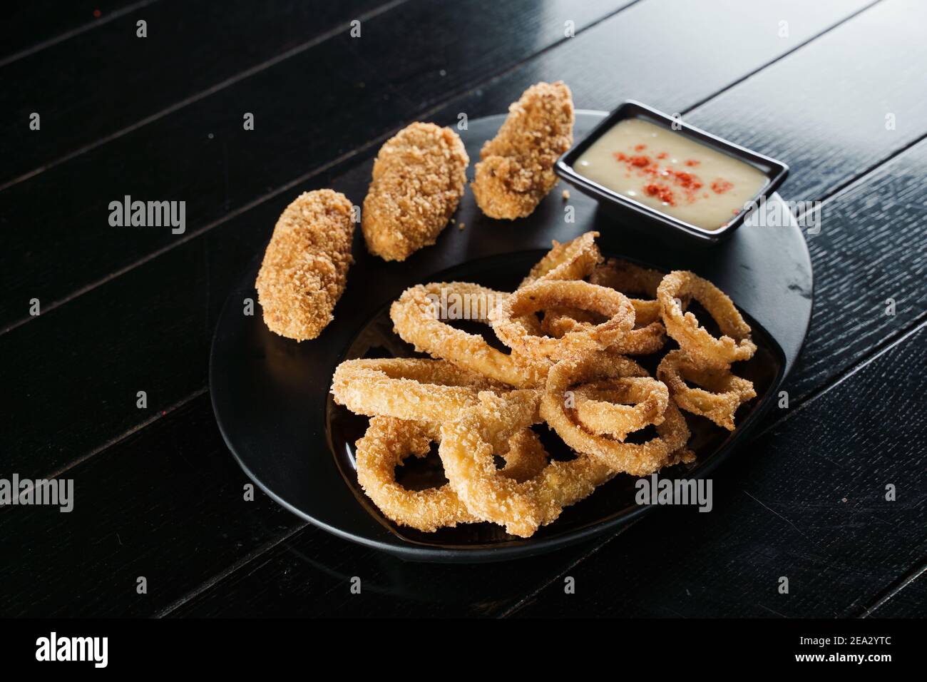 Beer snacks. Breaded meat appetizer and onion rings Stock Photo - Alamy