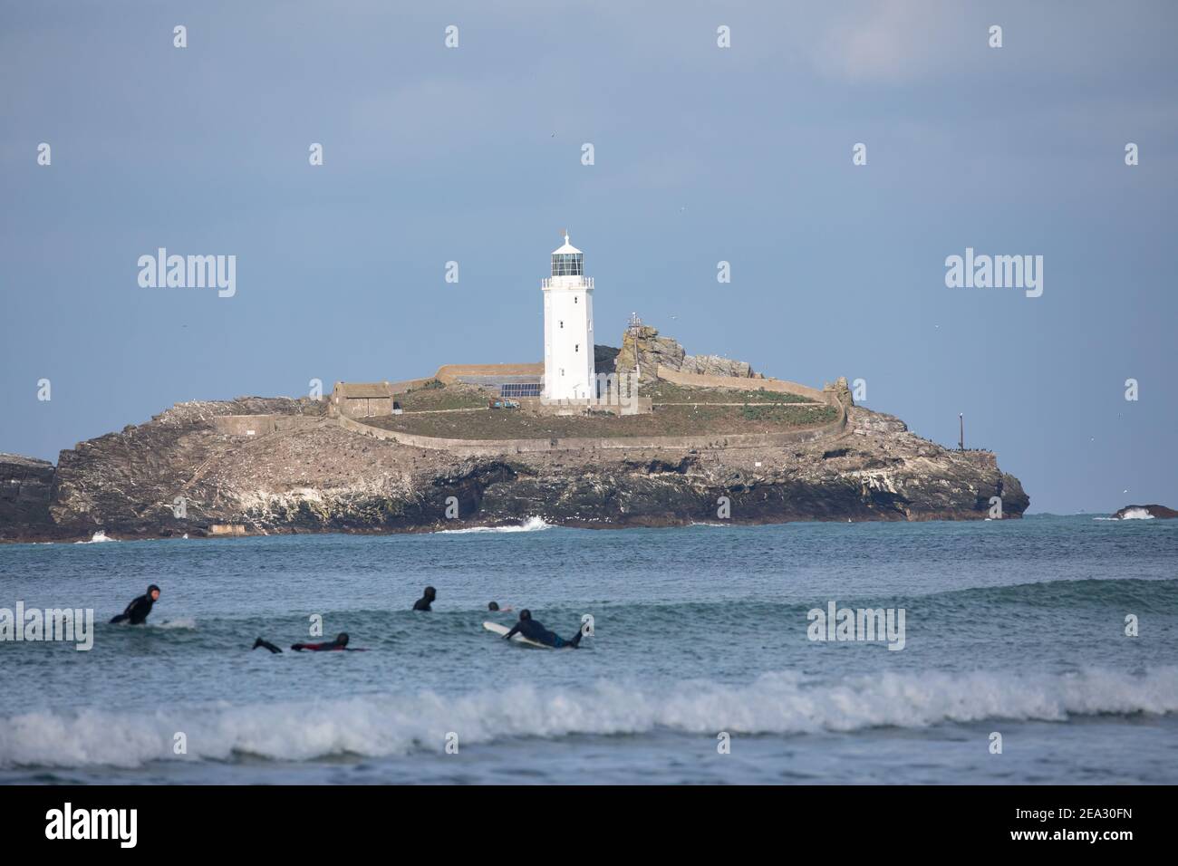 Surfers seen from St Gothian Sands in Cornwall, UK Stock Photo - Alamy