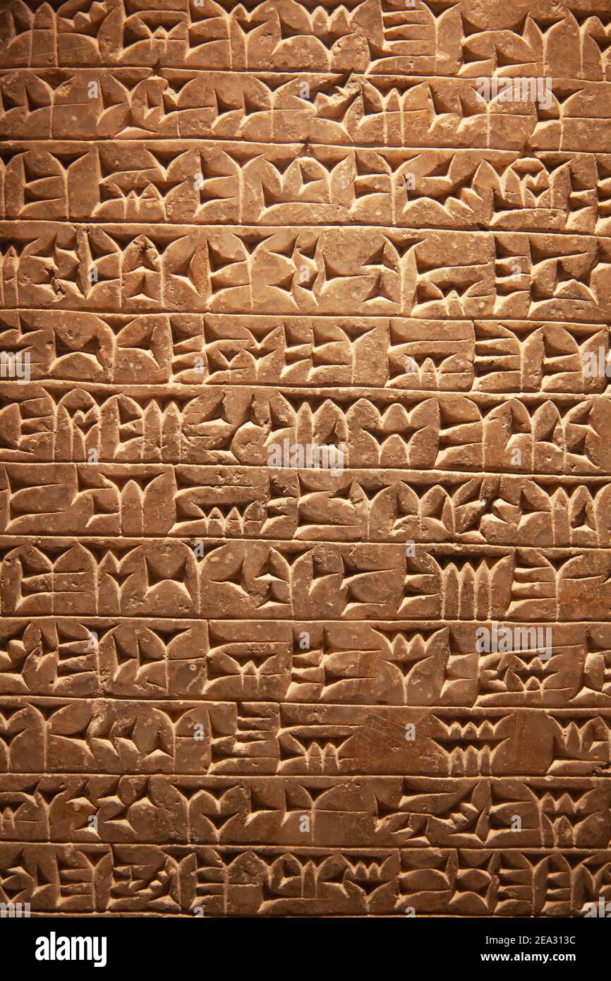 Ancient sumerian stone carving with cuneiform scripting Stock Photo - Alamy