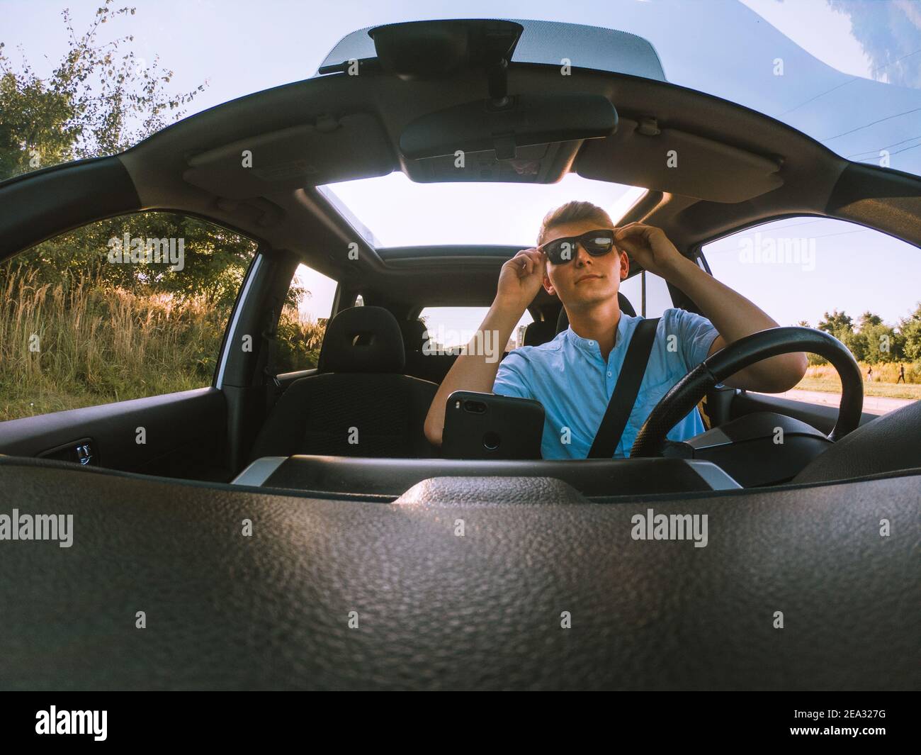 man sitting inside the car driving copy space Stock Photo - Alamy
