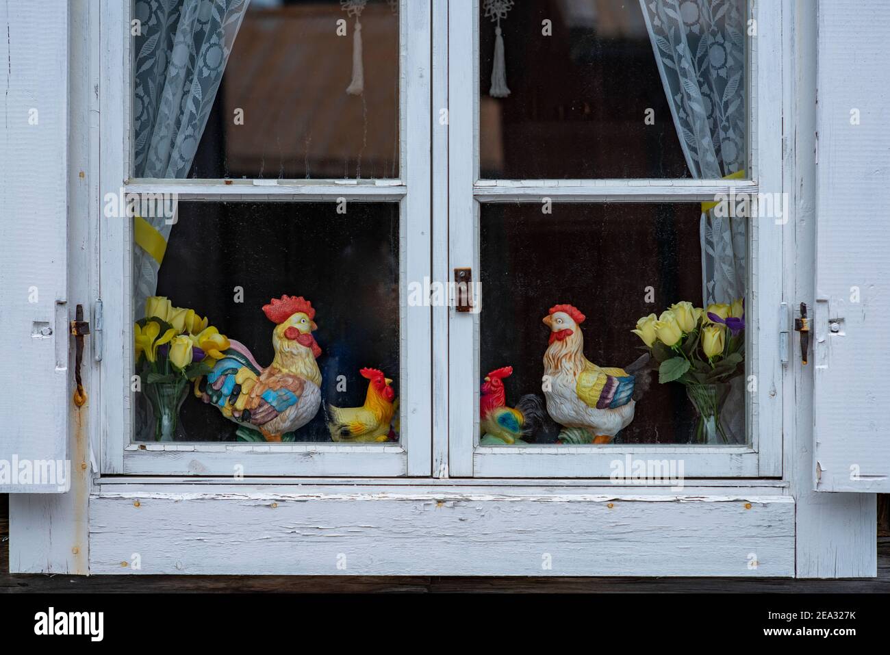 Holiday window decor viewed from outside on wooden Swedish cabin Stock ...