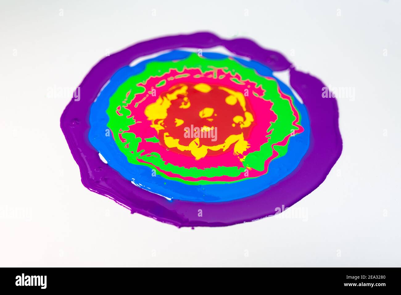 Various colors drop in lines on a white circle radial background and ...