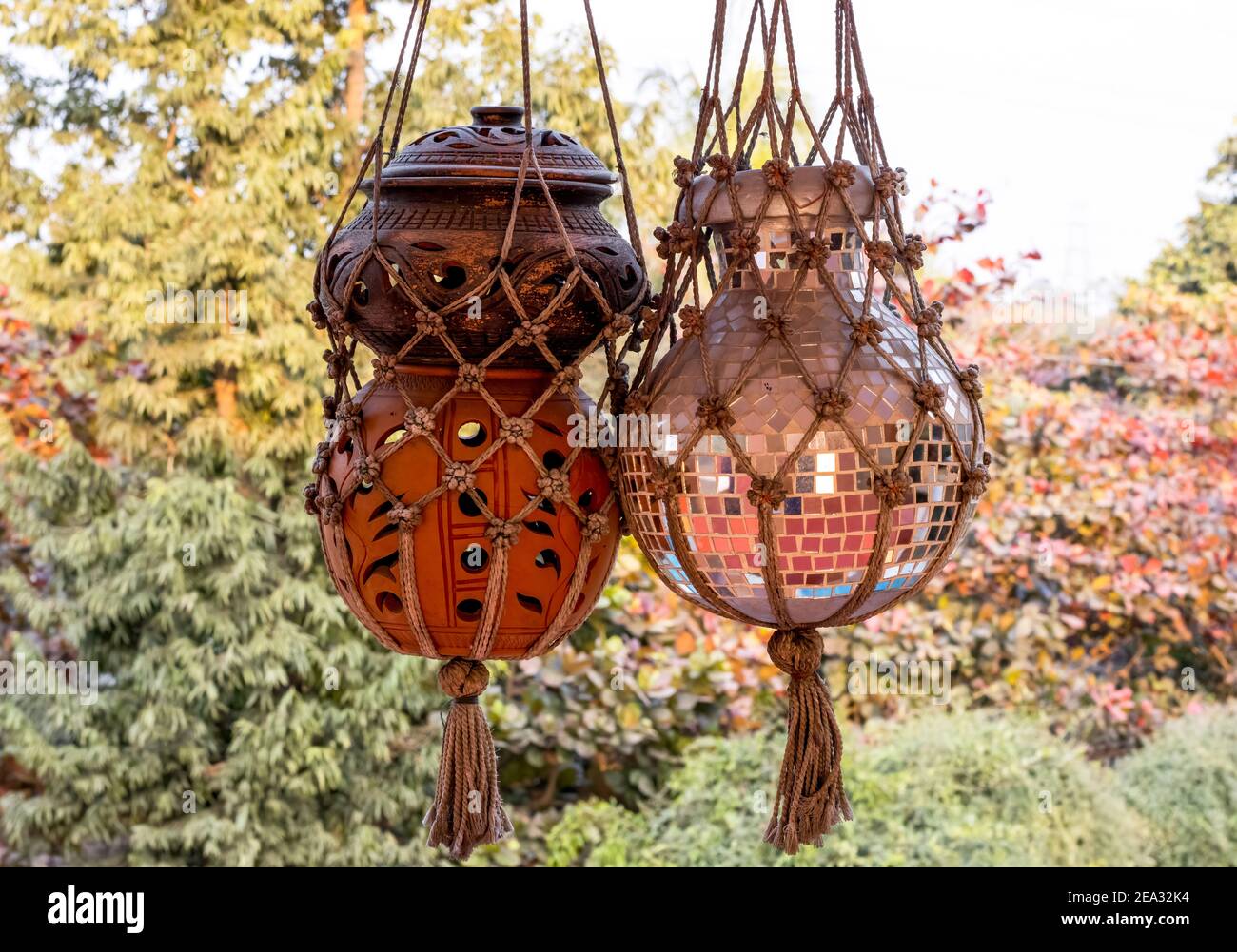 Hanged decorative jars with rope Stock Photo - Alamy