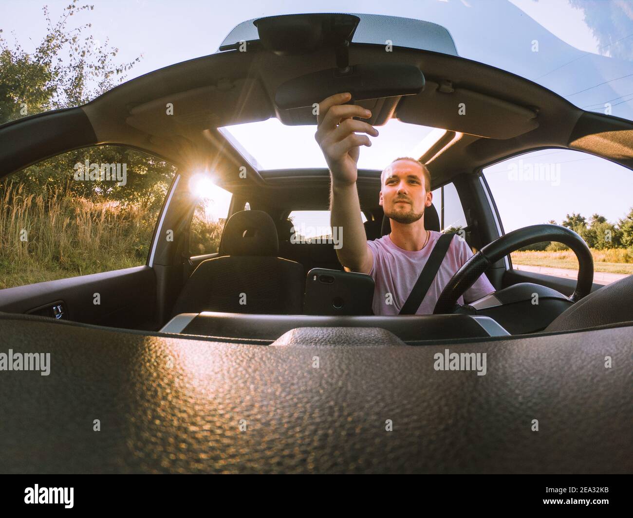 man sitting inside the car driving copy space Stock Photo - Alamy