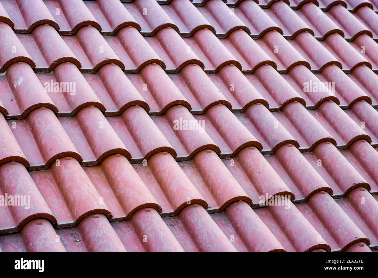 Roof tiles close up side view background Stock Photo - Alamy