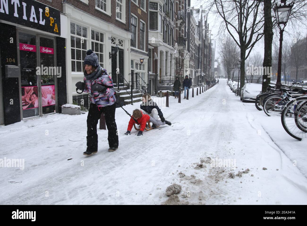 Amsterdam, Netherlands. 07th Feb, 2021. People enjoying during snowfall ...