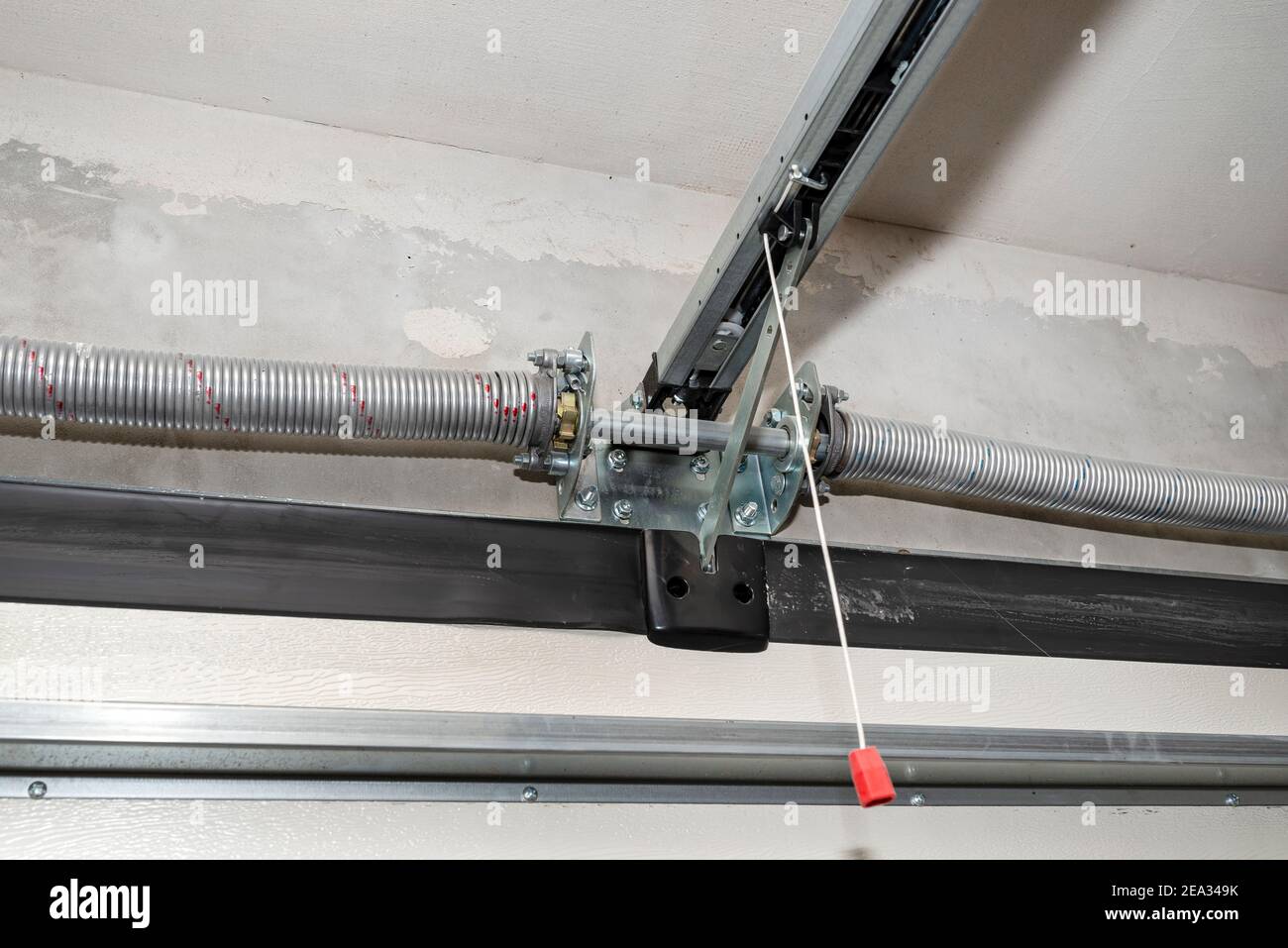 Springs tensioning the home garage door mechanism, view from the inside ...
