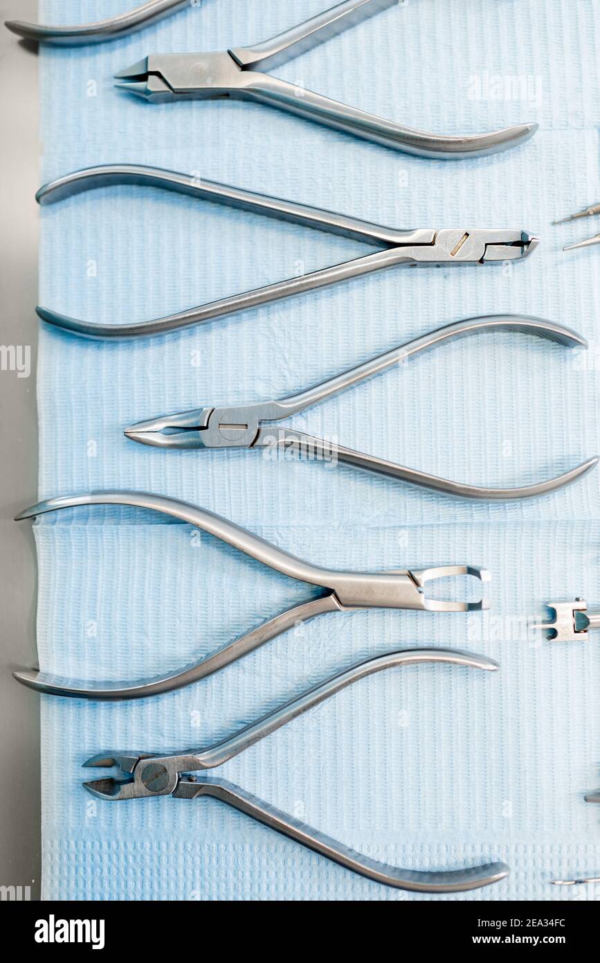 Dental tools for orthodontic treatment lying on the table Stock Photo ...