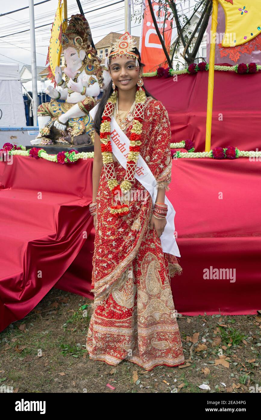 Posed portrait of a pretty young teen age Hindu girl wearing a Queens ...