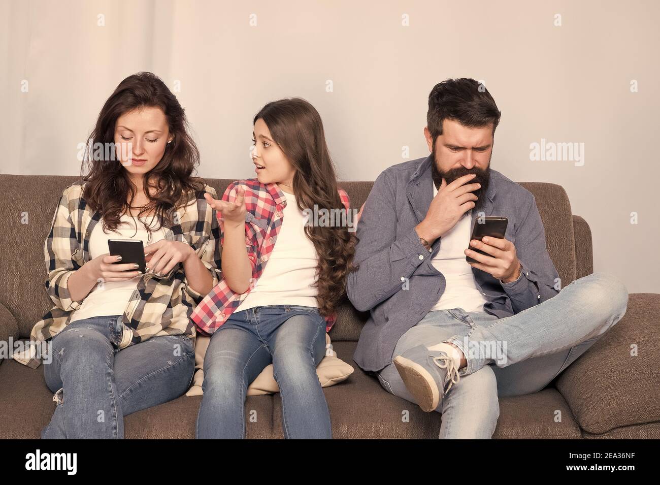 Busy parents and ignoring daughter hi-res stock photography and images ...