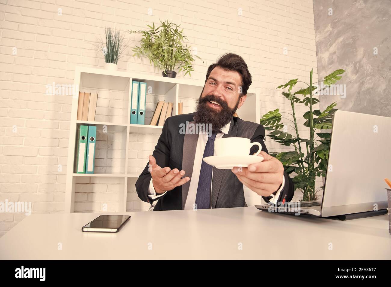 Please have some and enjoy. Happy boss serve hot cup at desk. Employer ...