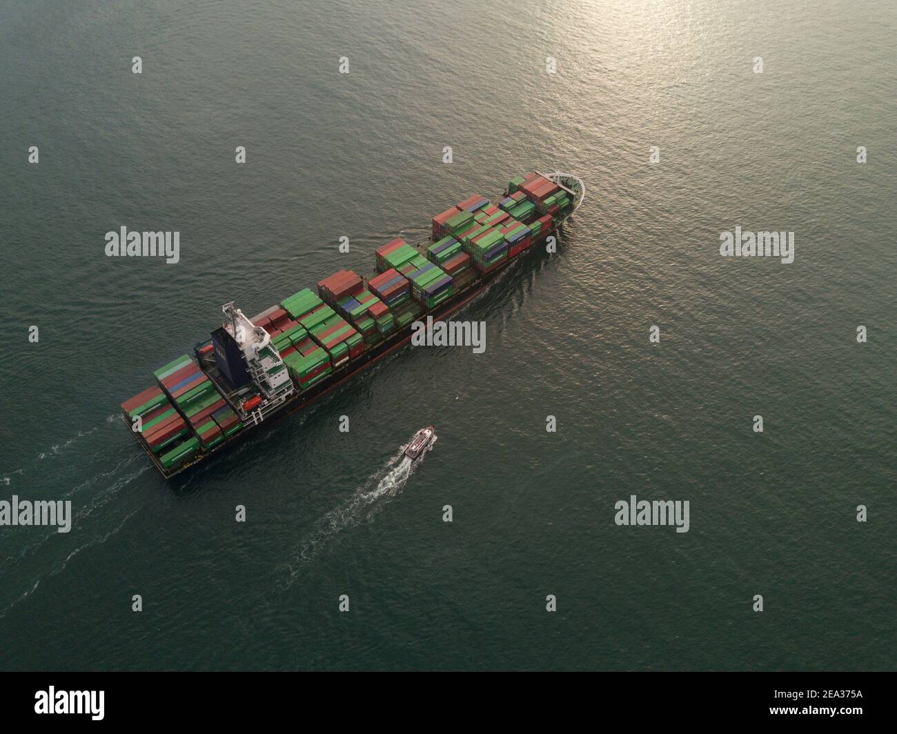 Aerial view from a drone of a container ship, carrying bulk containers ...