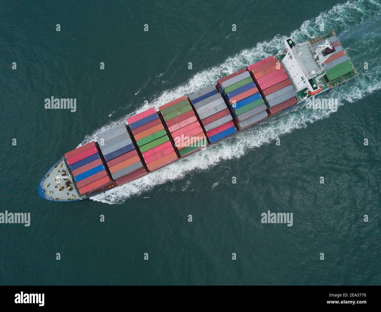 Aerial view from a drone of a container ship, carrying bulk containers ...