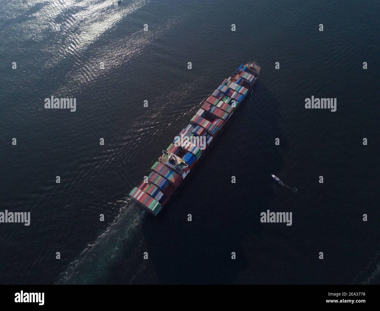 Aerial view from a drone of a container ship, carrying bulk containers ...