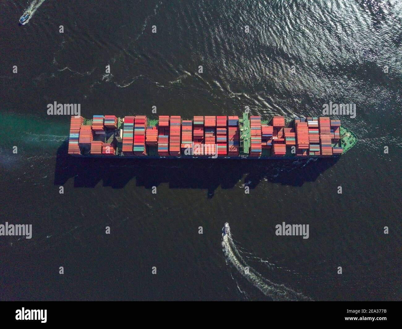 Aerial view from a drone of a container ship, carrying bulk containers ...